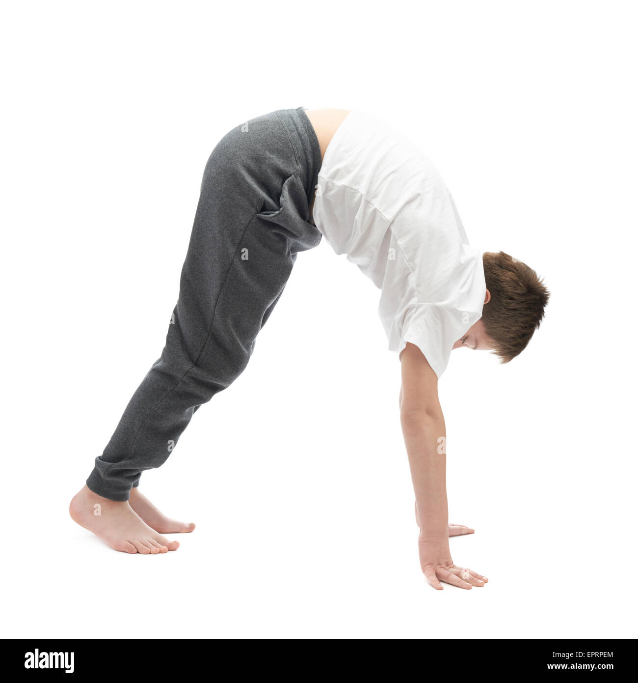 Young boy stretching or doing yoga Stock Photo - Alamy