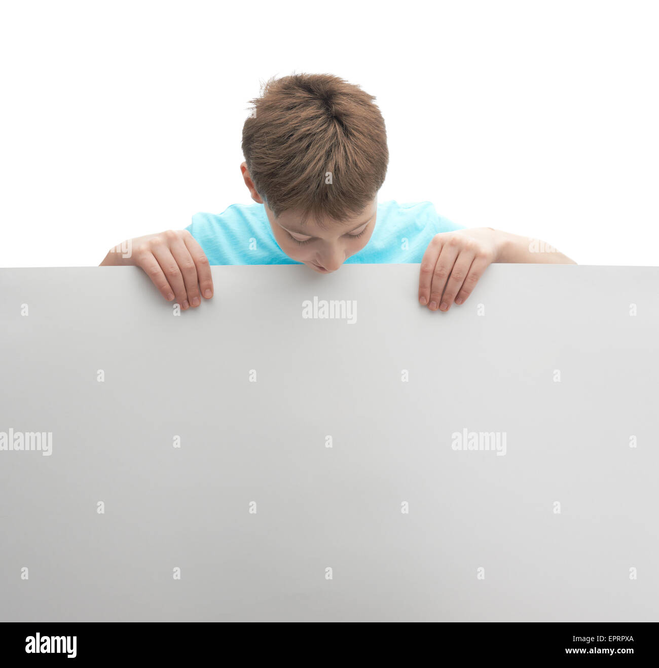 Young boy with a sheet of paper Stock Photo - Alamy