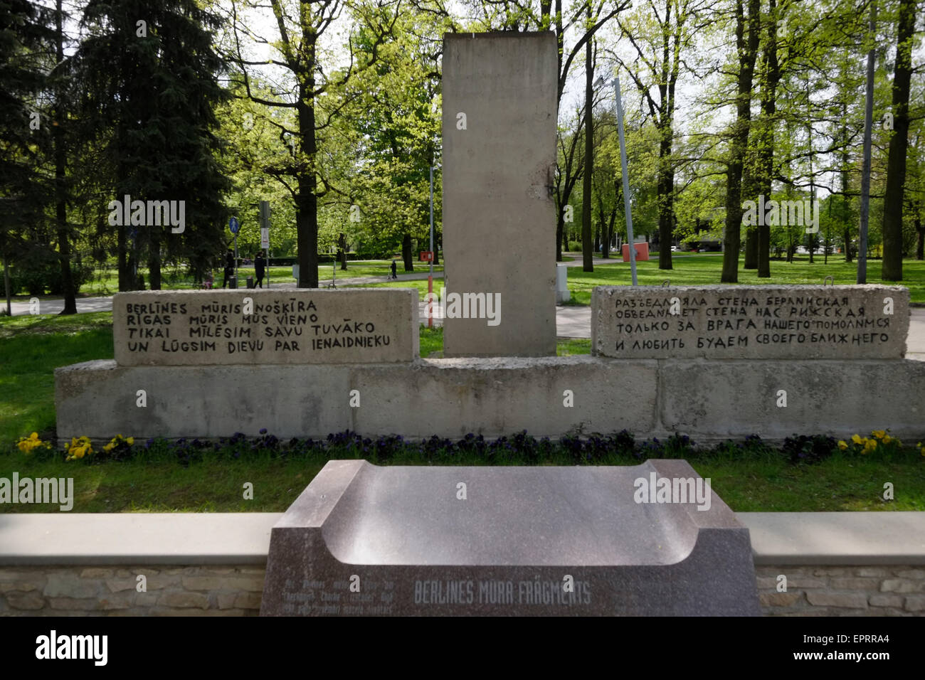 A segment of the Berlin Wall placed in Kronvalds park in front of the ...