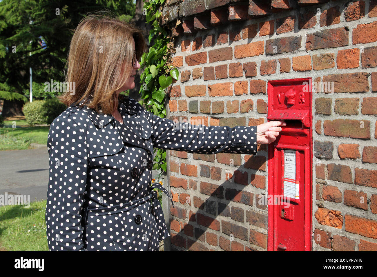 Woman posting letter in post hi-res stock photography and images - Alamy