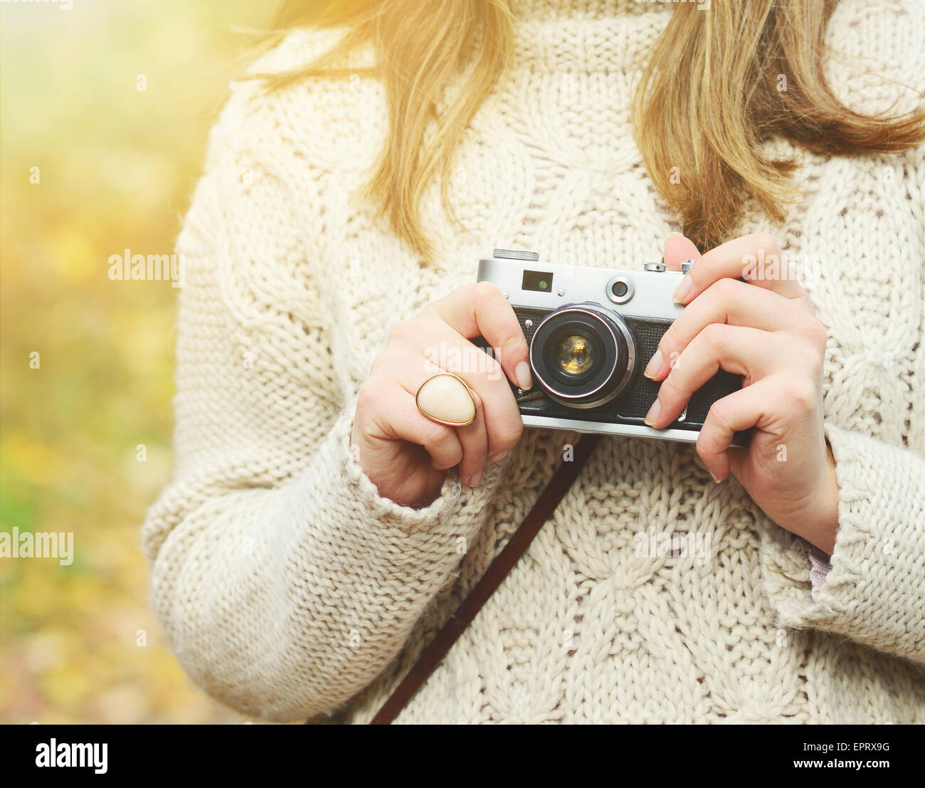 Woman hand holding retro camera close-up Stock Photo - Alamy