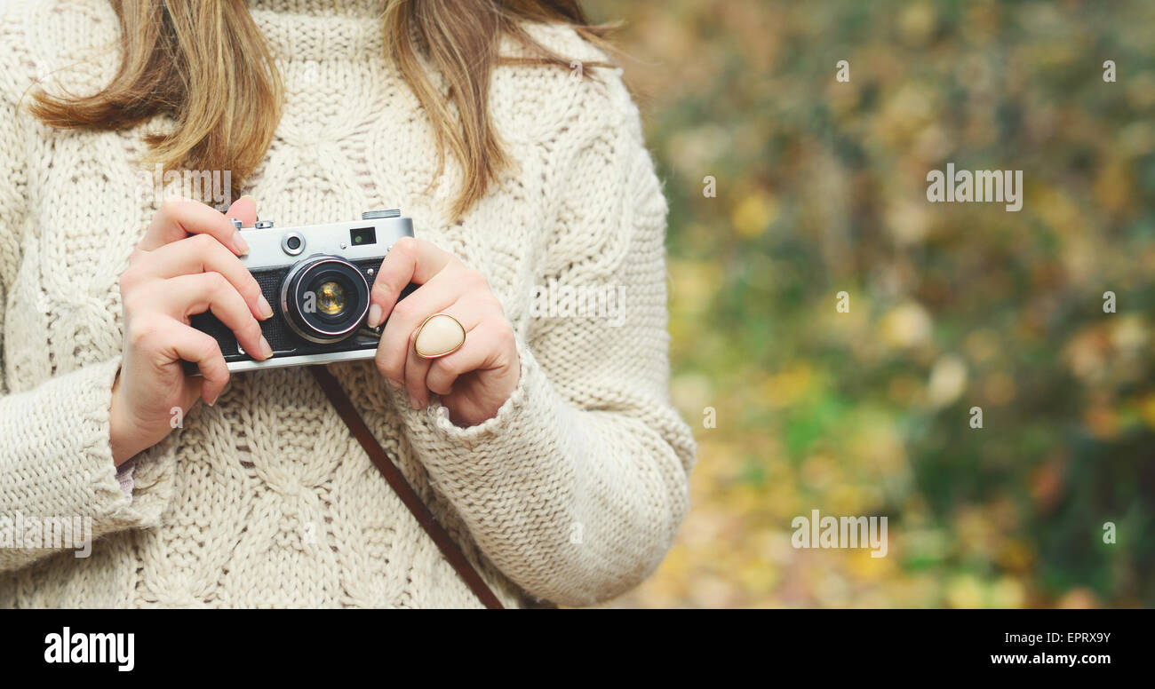 Woman hand holding retro camera close-up Stock Photo - Alamy