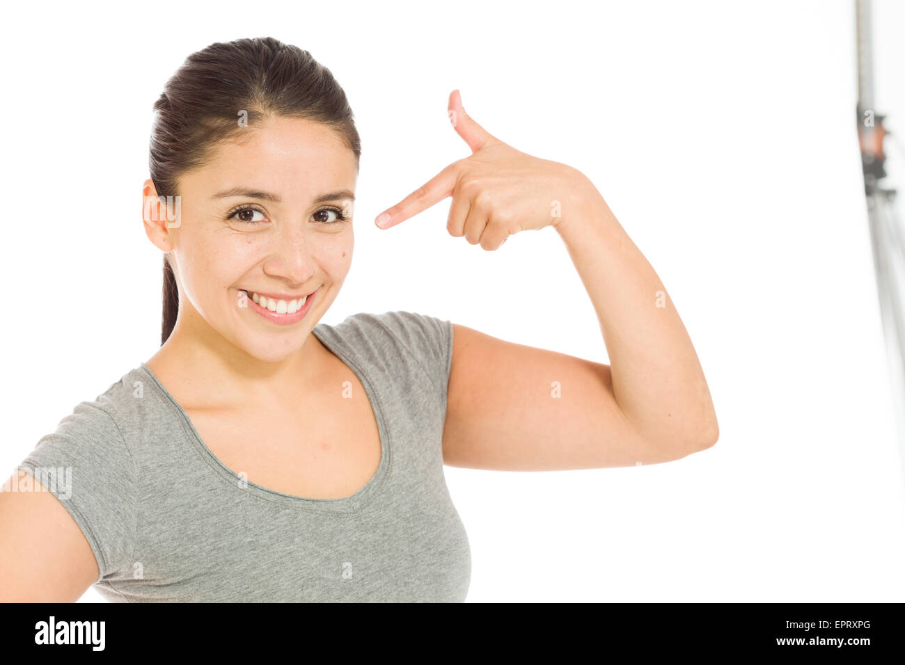 Model isolated on plain background in studio pointing Stock Photo - Alamy