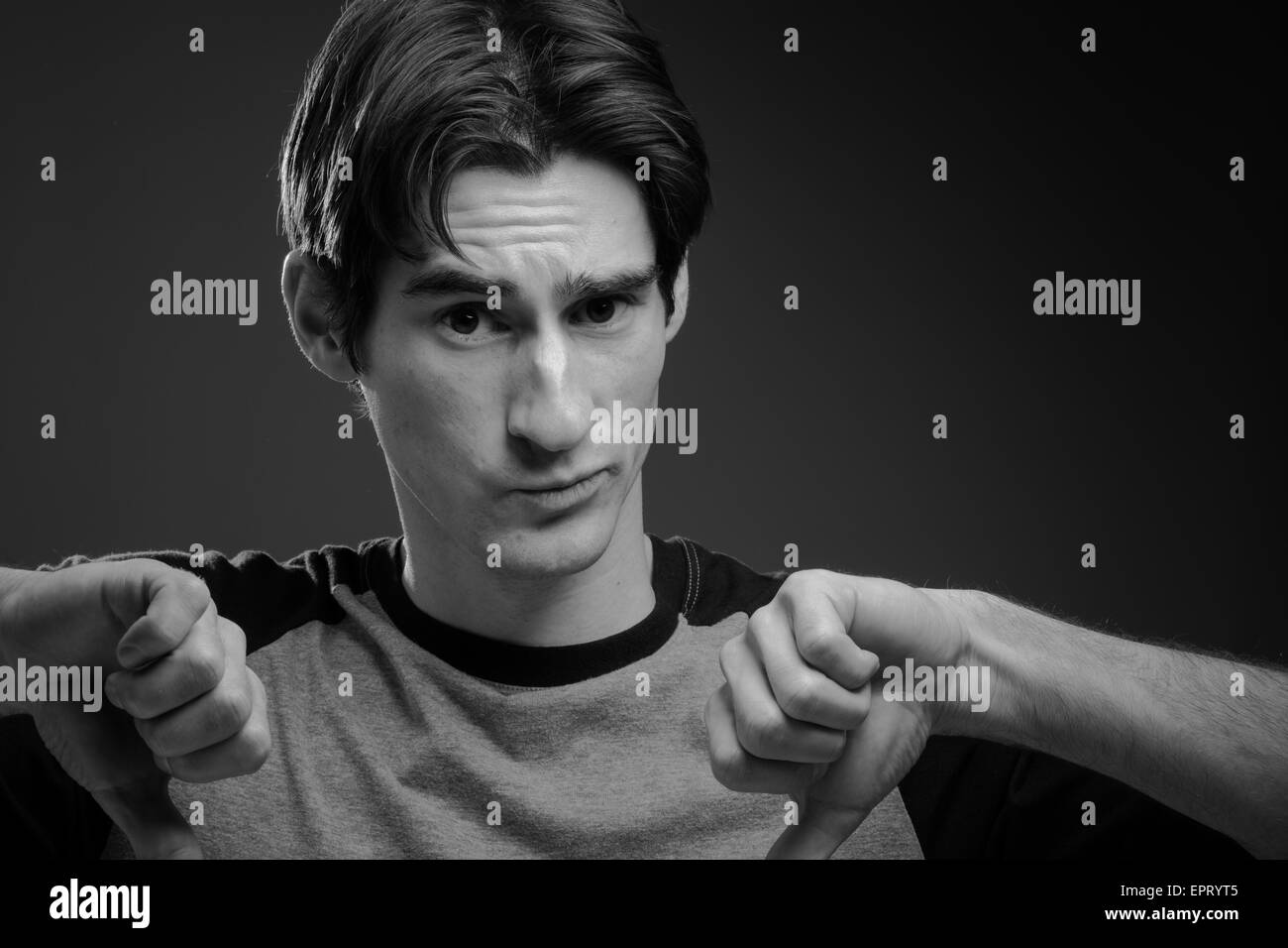 Thumbs up thumbs down Black and White Stock Photos & Images - Alamy