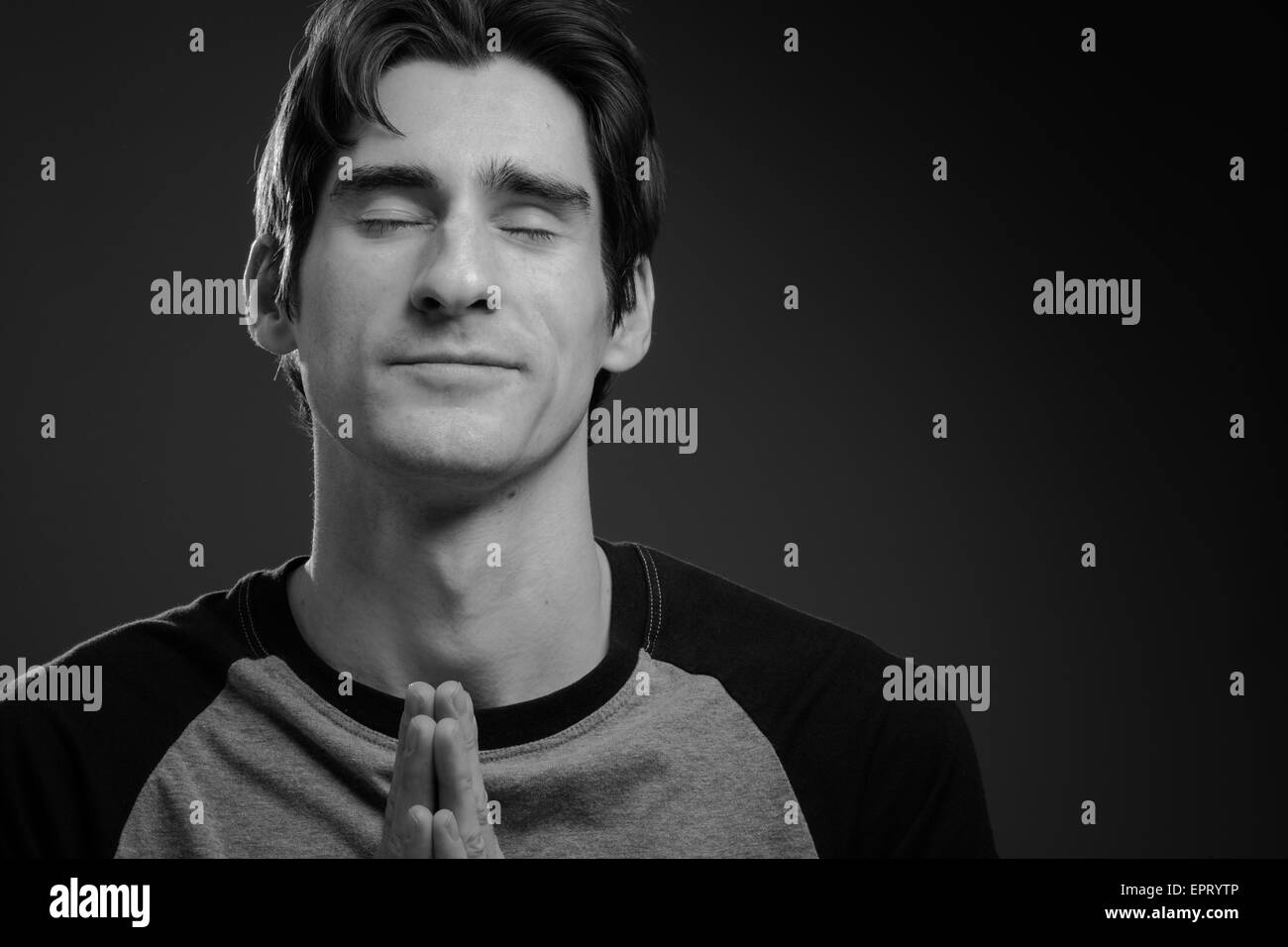 Model isolated praying Stock Photo - Alamy