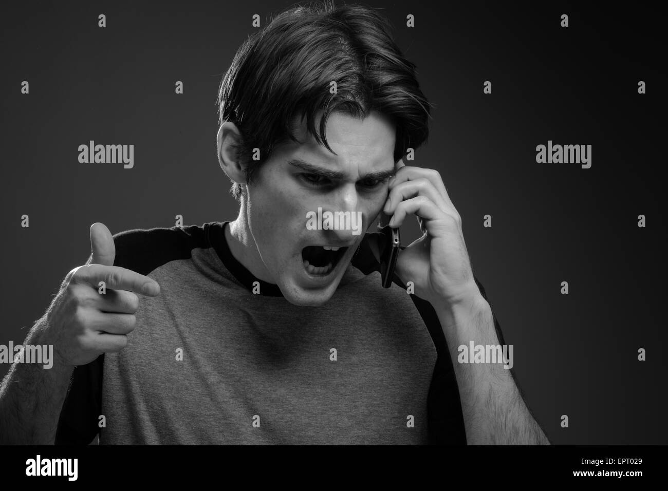 Model angry scolding and pointing Stock Photo - Alamy