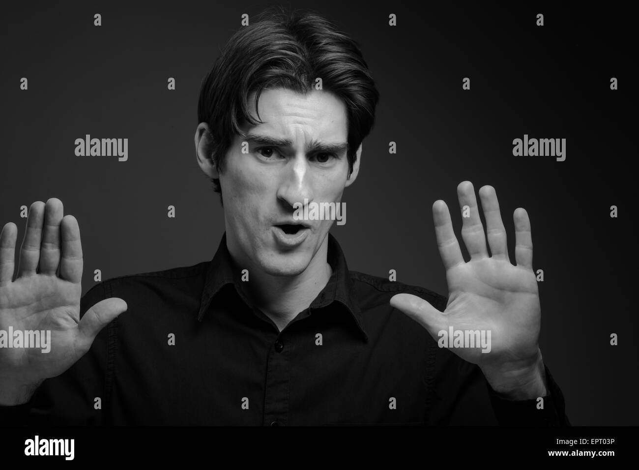 Hand stop suit Black and White Stock Photos & Images - Alamy
