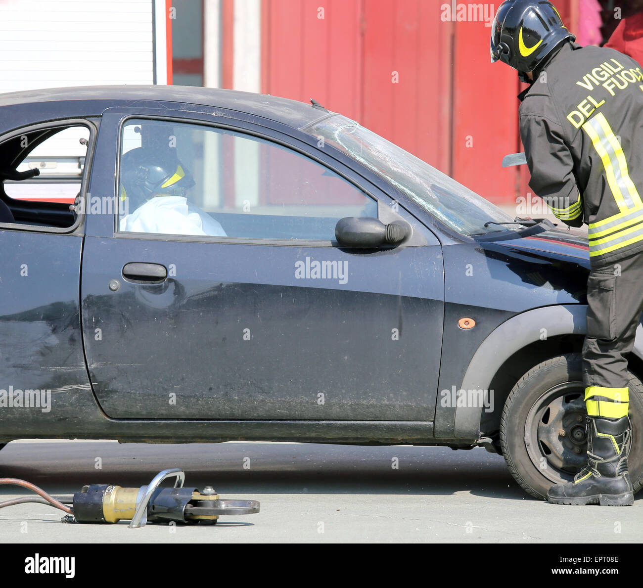 firefighters during training exercise cuts the windscreen of the car ...