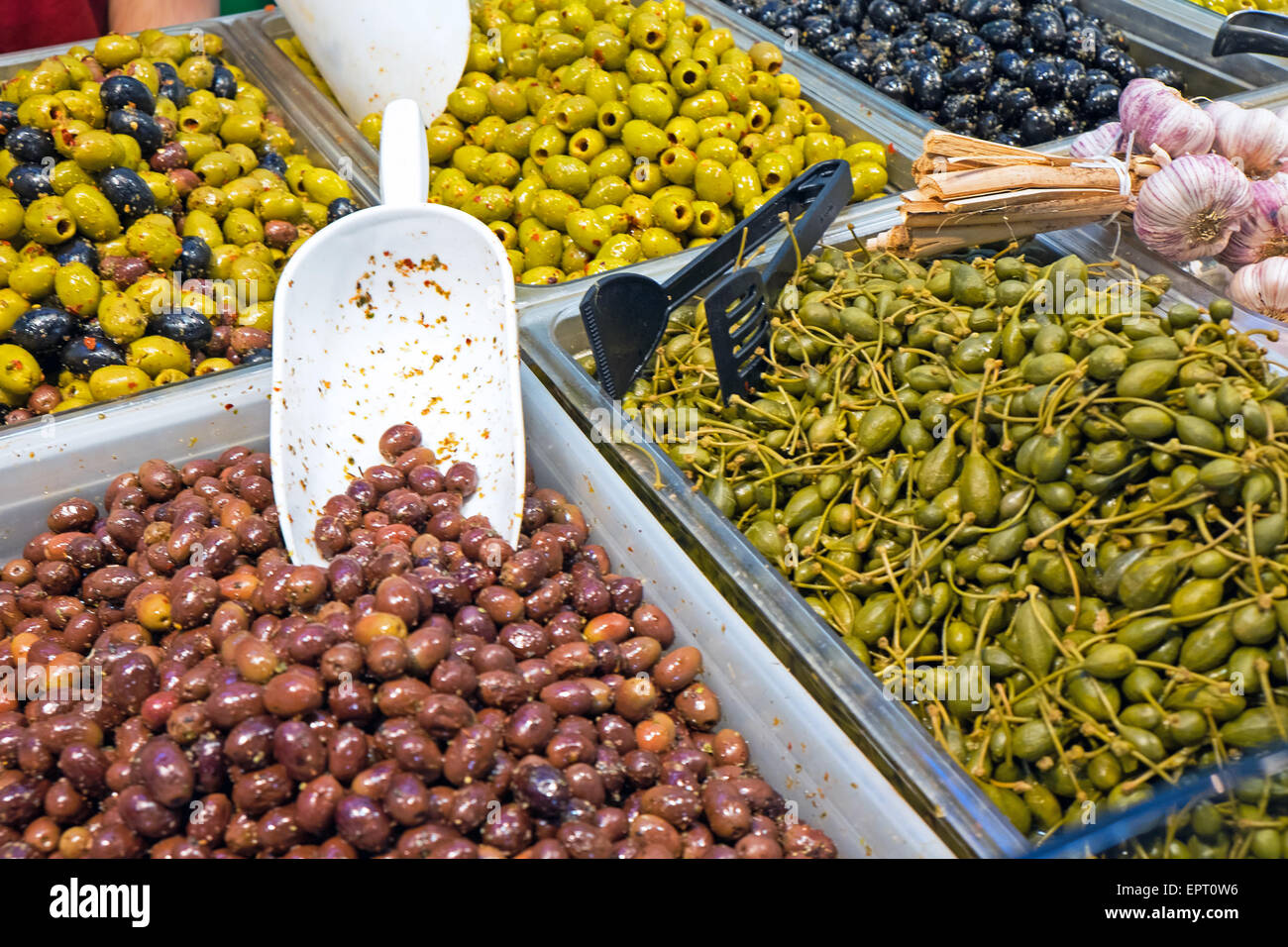 Different kinds of olives and capers for sale at a market Stock Photo ...