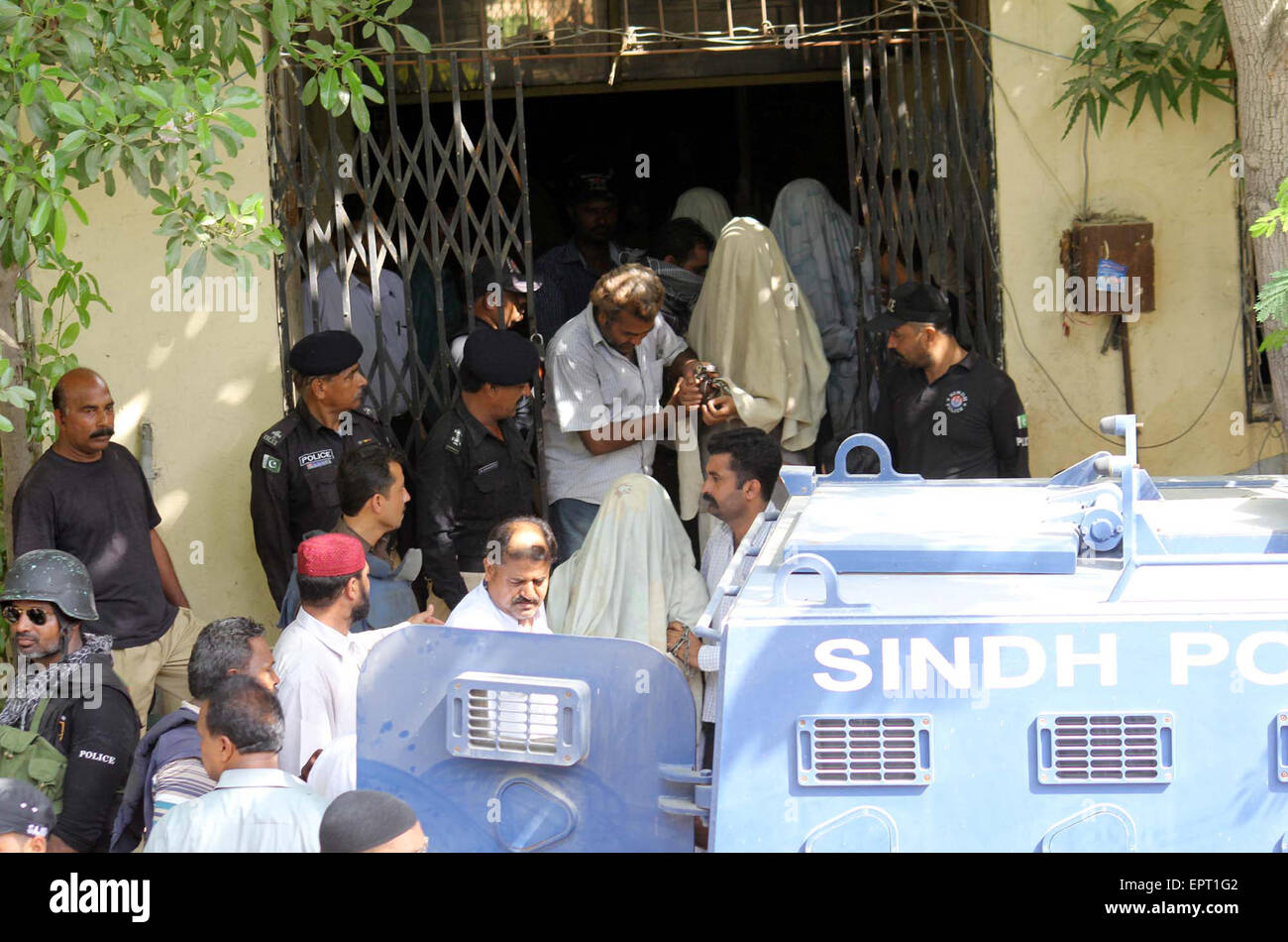 Security officials escort suspected criminals accused in a bus attack ...