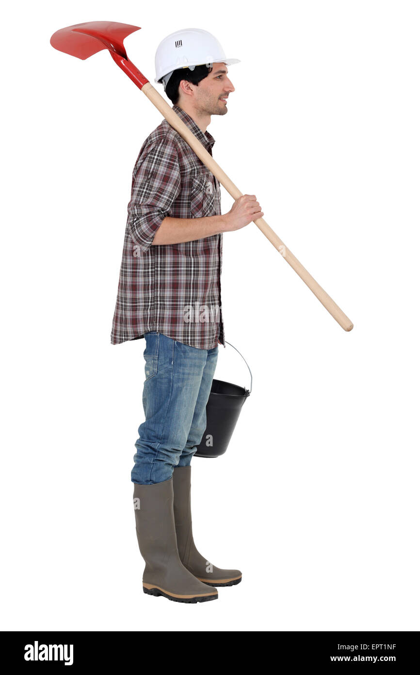 Construction worker with a shovel Stock Photo - Alamy