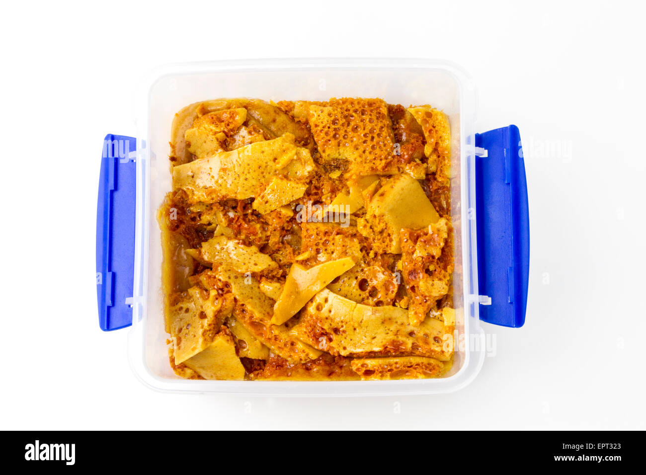 Home made honeycomb in a plastic container Stock Photo - Alamy