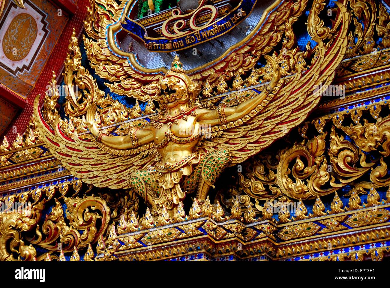 Bangkok, Thailand: An immense gilded Phoenix with open wings decorates ...