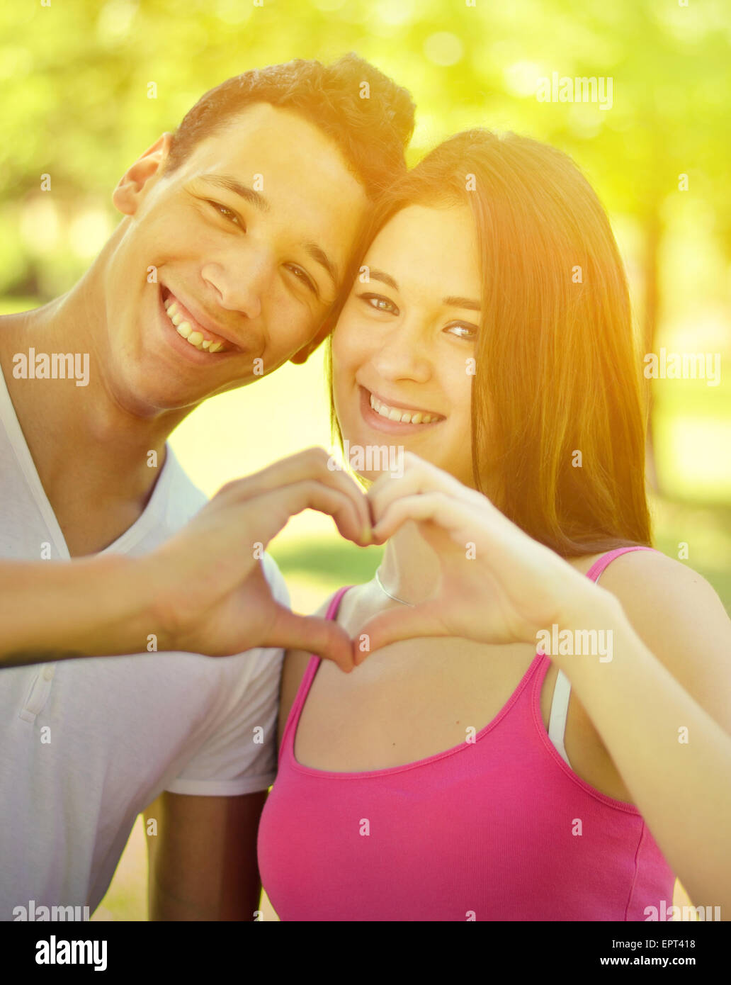 Couple making heart with hands outdoor Stock Photo - Alamy