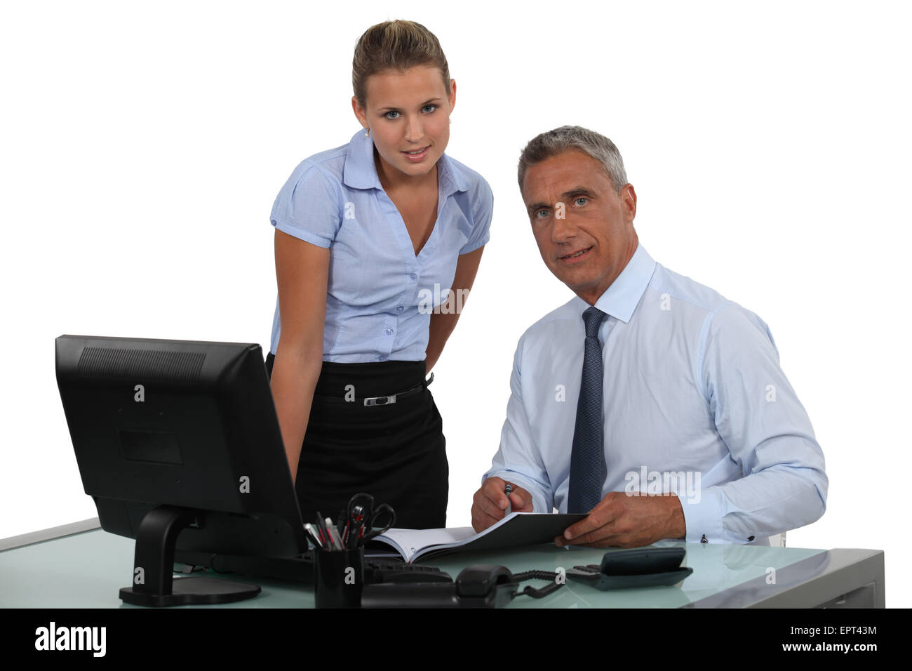 Assistant getting boss's signature Stock Photo - Alamy