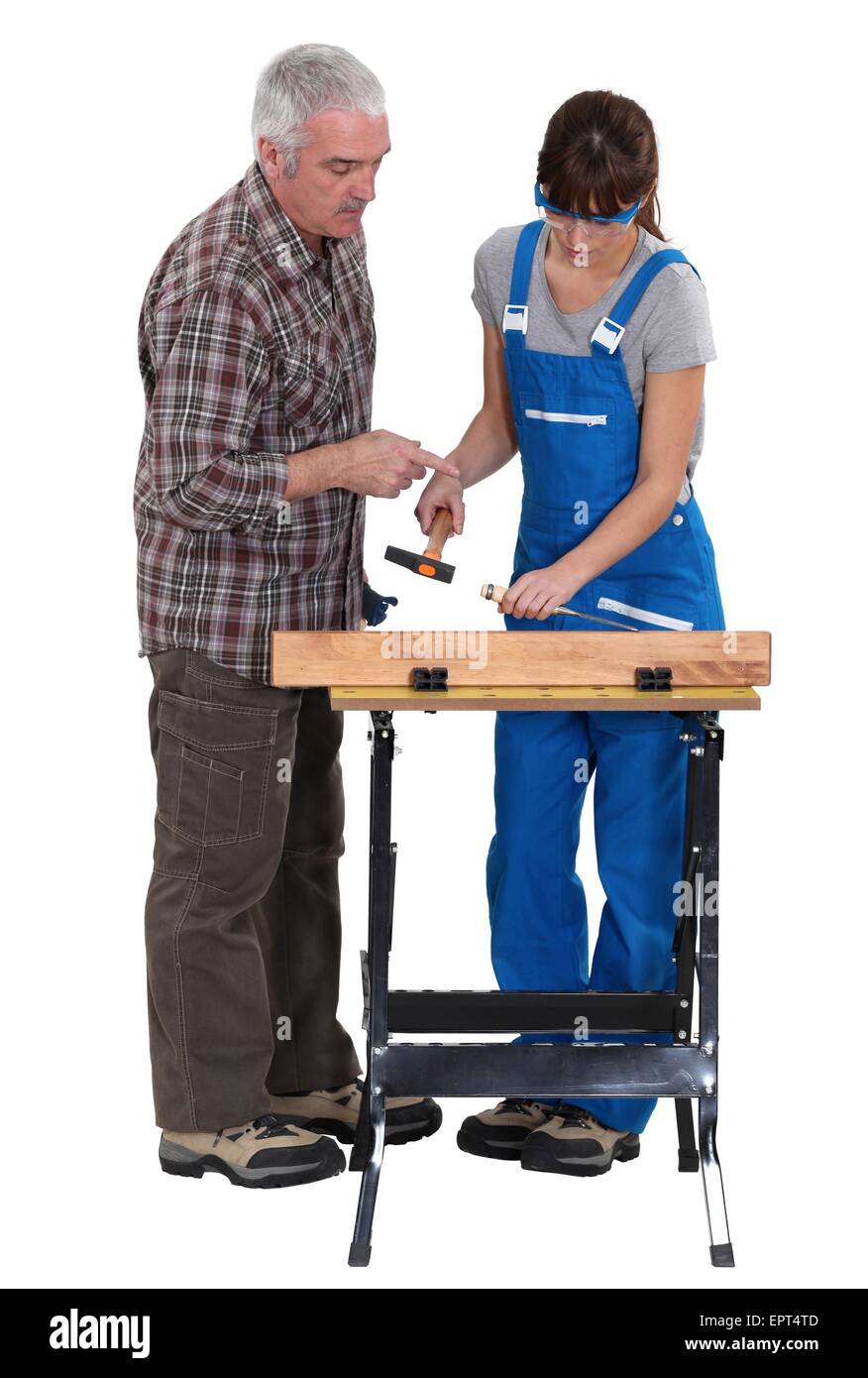 Carpenter training young female apprentice Stock Photo - Alamy