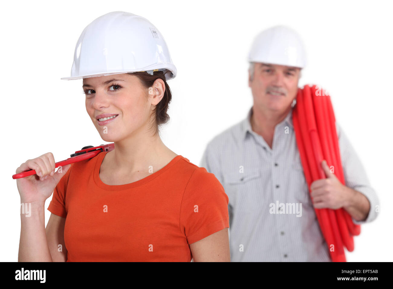 Plumber and female apprentice Stock Photo - Alamy
