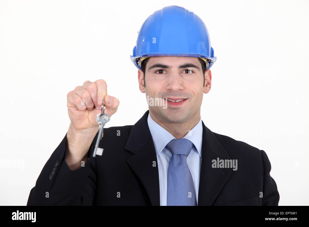 Architect holding key Stock Photo - Alamy