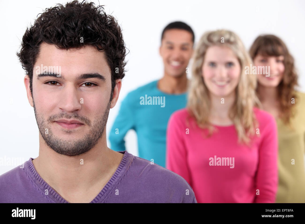 Young man with group of friends Stock Photo - Alamy