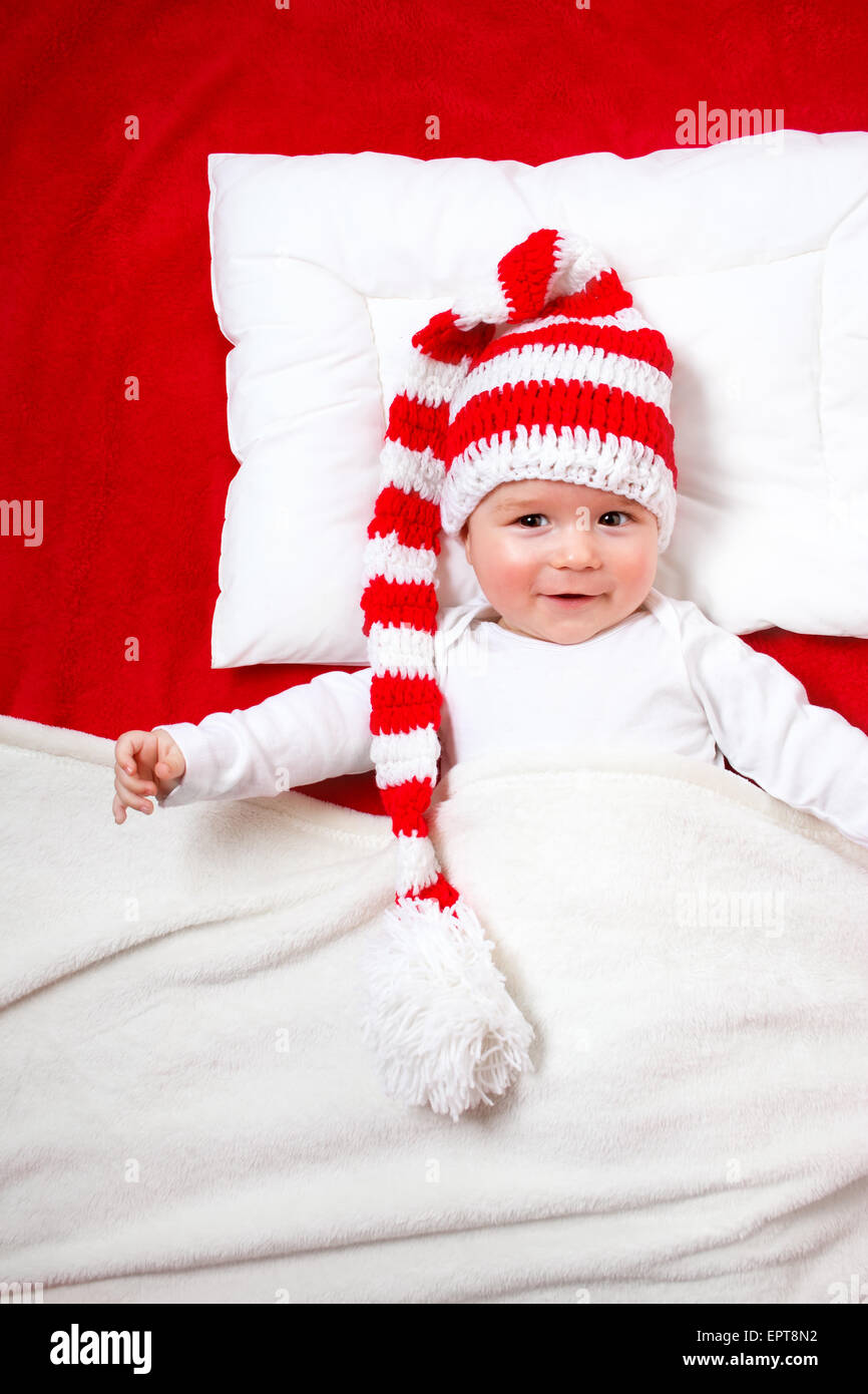 Baby has red cap hi-res stock photography and images - Alamy