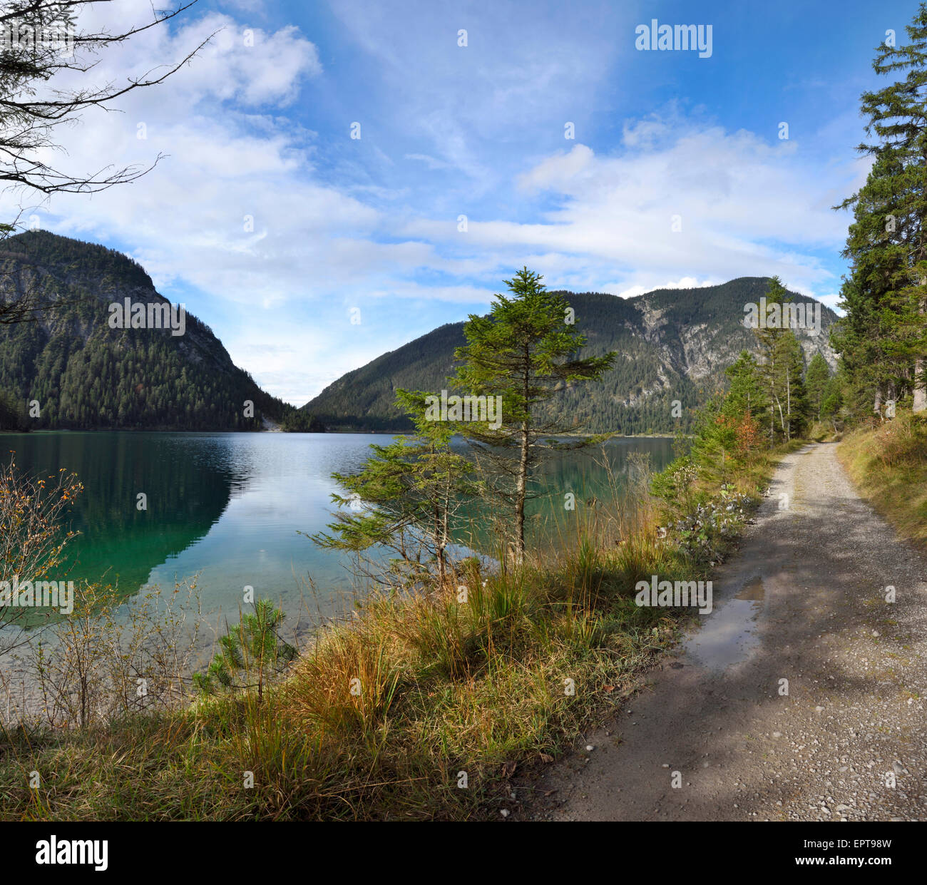 Landscape of a trail beside a clear lake in autumn, Plansee, Tirol ...