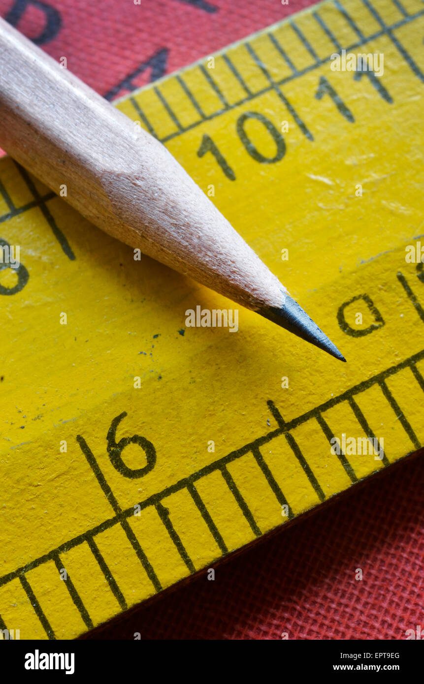 Close-up of sharpened pencil and wooden ruler Stock Photo - Alamy