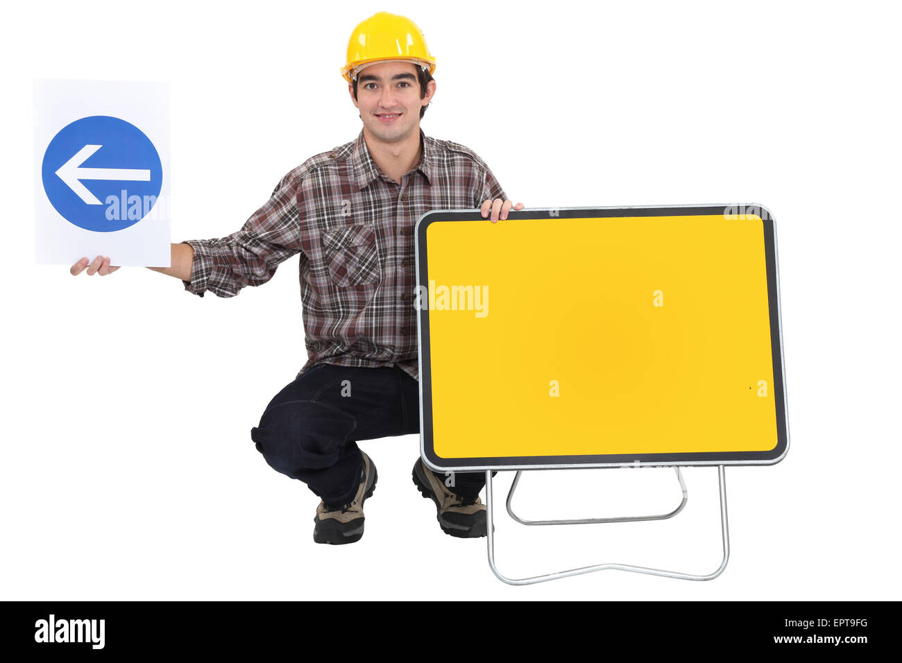 Man kneeling by traffic signs Stock Photo - Alamy