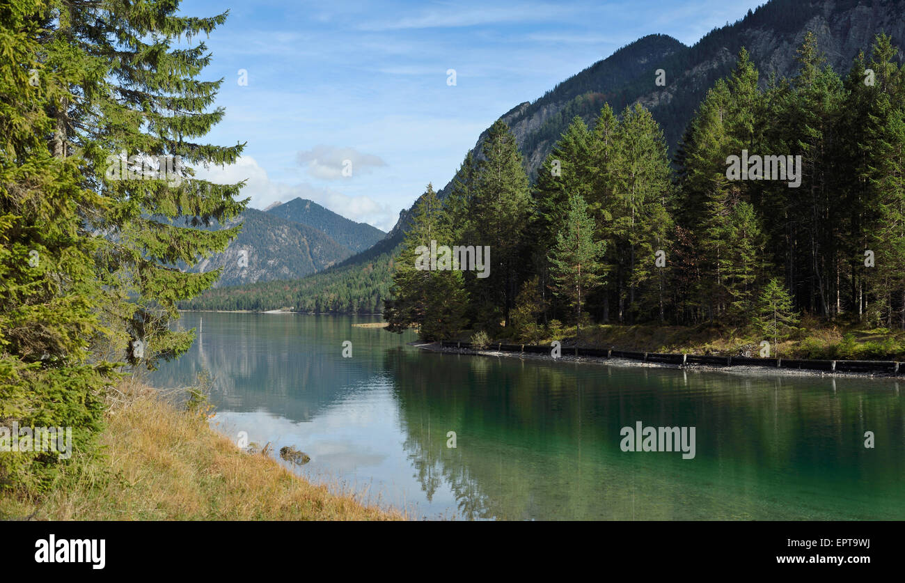 Scenic view of mountains and a clear lake (Plansee) in autumn, Tirol ...