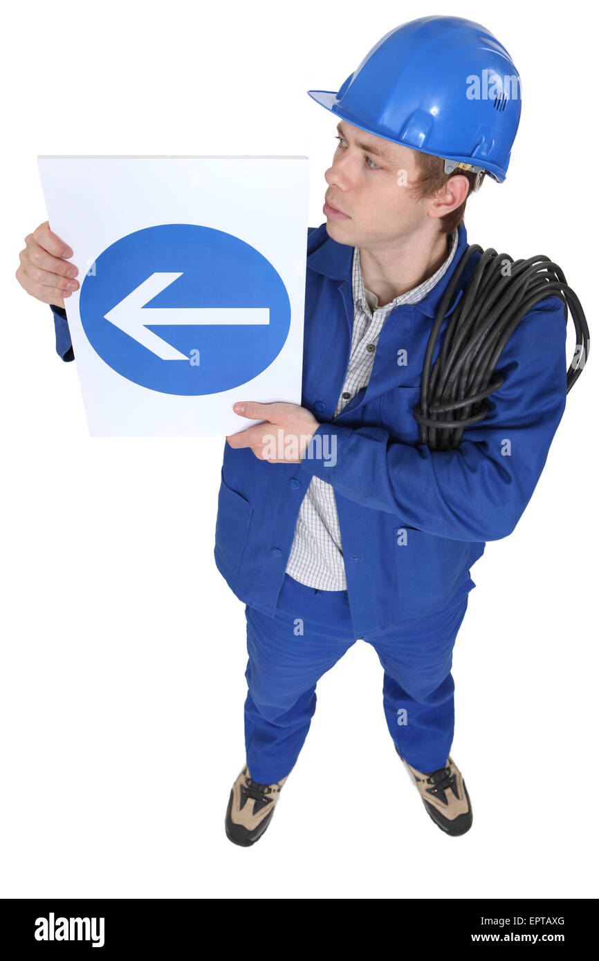 Traffic guard directing traffic Stock Photo - Alamy