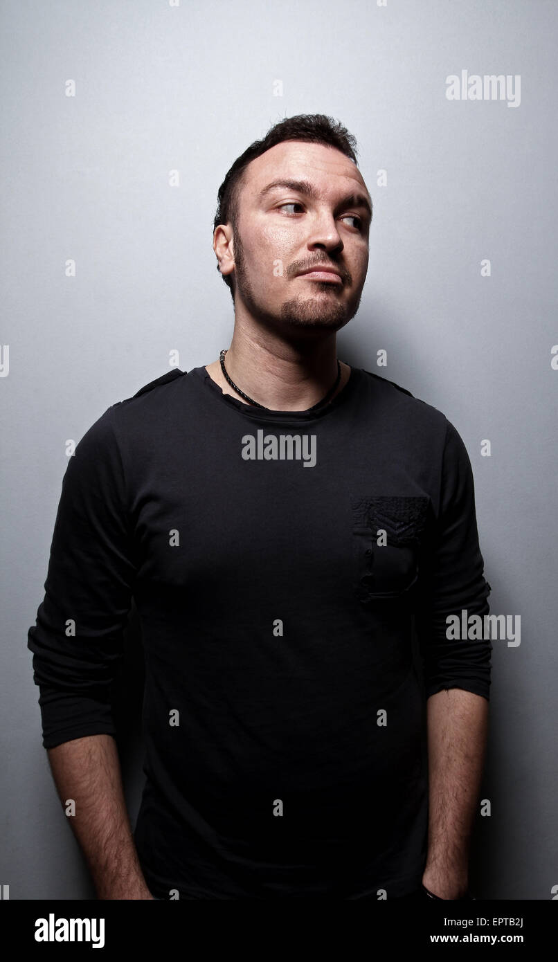 Male models fashion shooting, He is posing with a dark blue shirt Stock ...