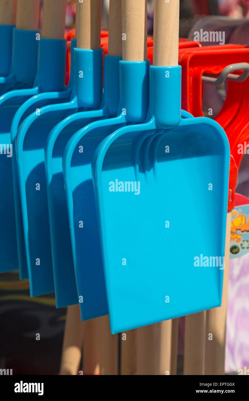 Close-up of colorful children's spades at a souvenir stall on the ...