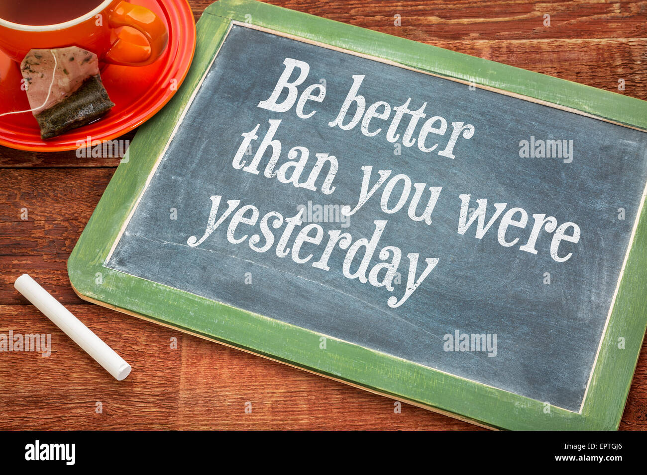 Be better than you were yesterday - motivational text on a slate ...