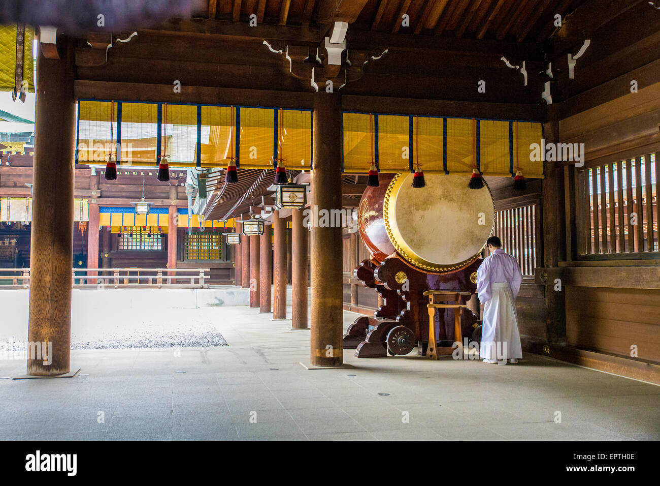 Man beating a gong in a Japanese temple Stock Photo - Alamy