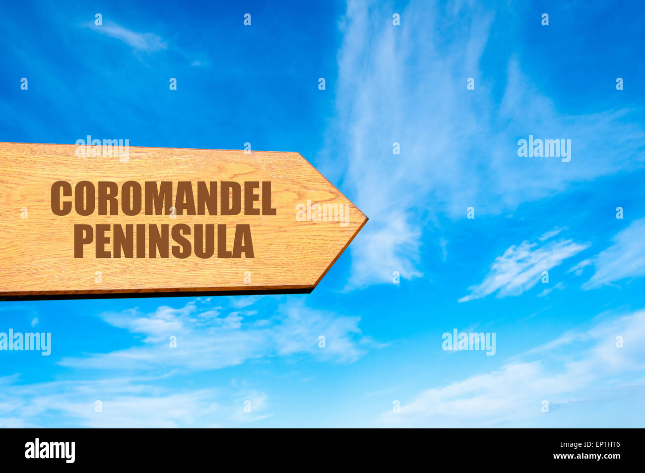 Wooden arrow sign pointing destination COROMANDEL PENINSULA, NEW ...