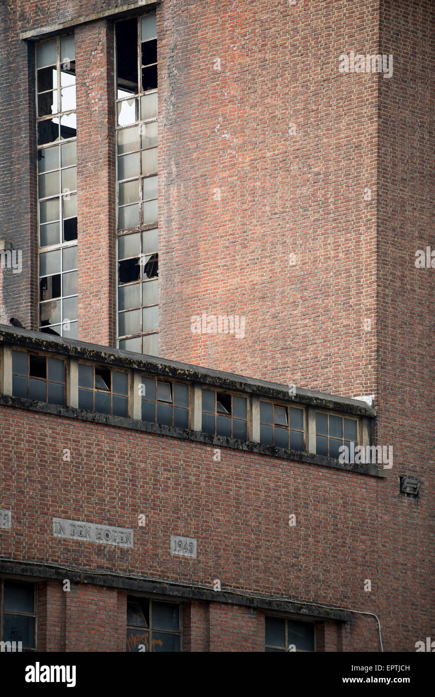 Shattered windows in old industrial building with brick walls Stock ...