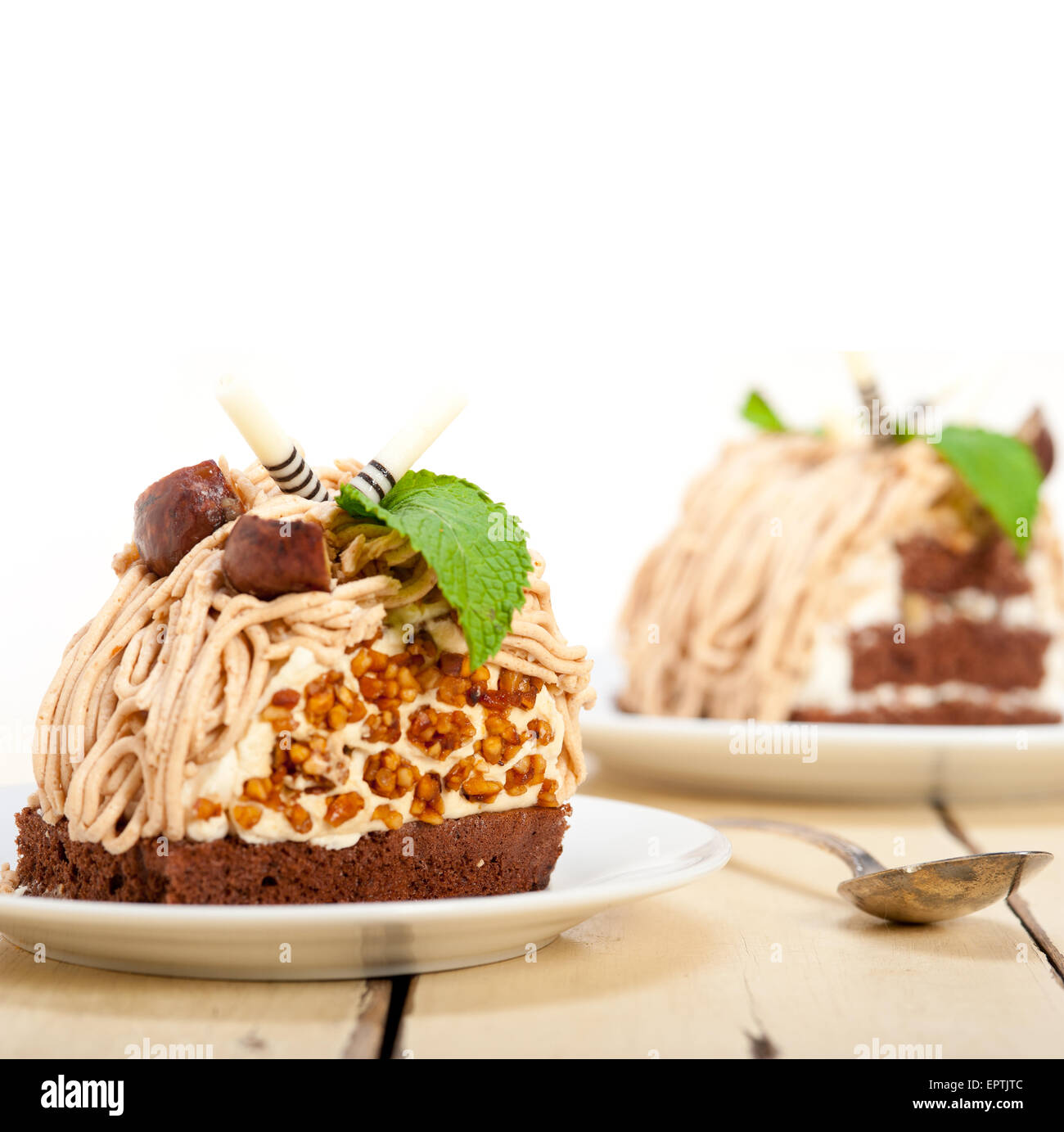 fresh baked chestnut cream cake dessert over rustic white wood table ...