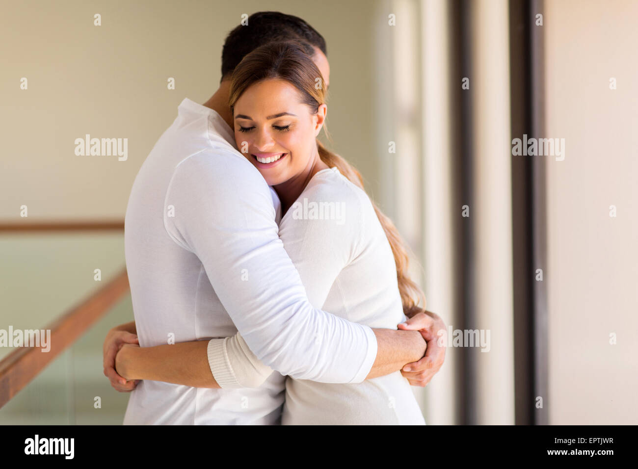 happy woman hugging her husband Stock Photo - Alamy