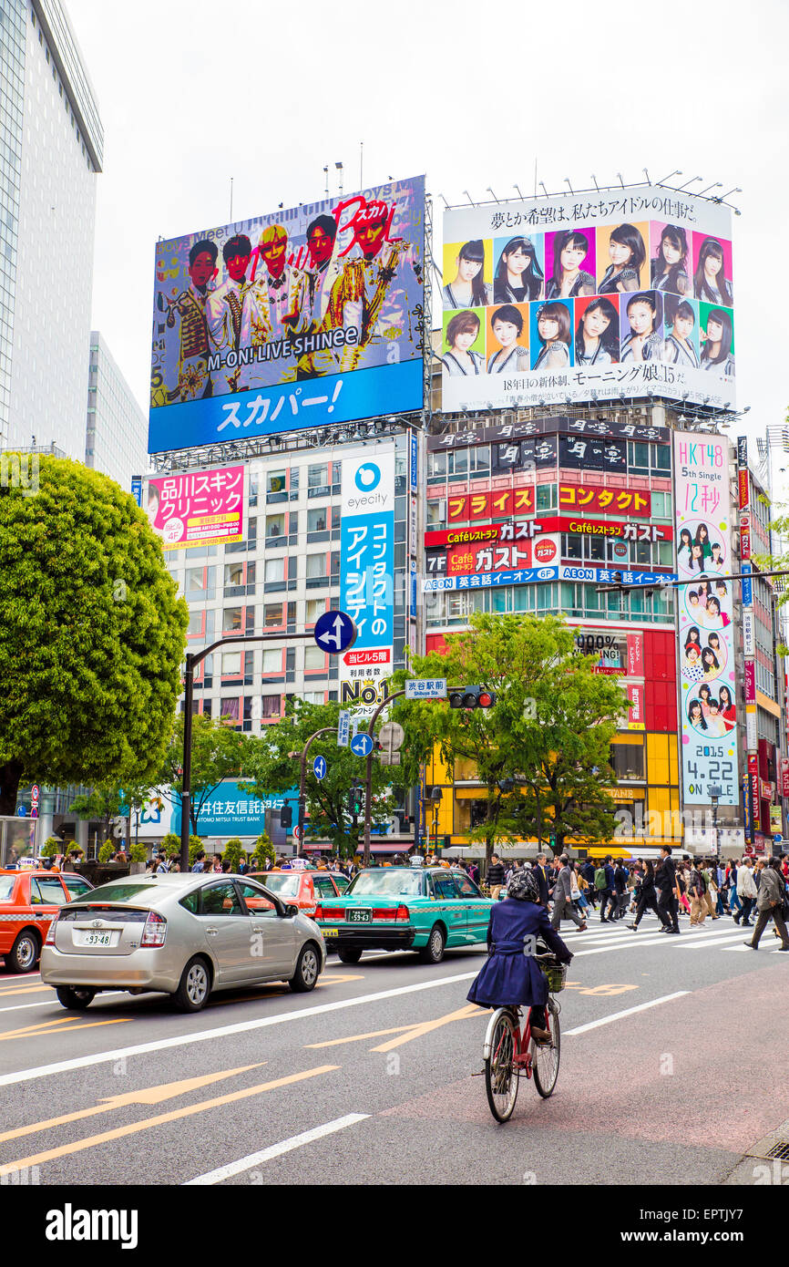 Street view of Tokyo Japan with people and neon signs and adverts Stock ...