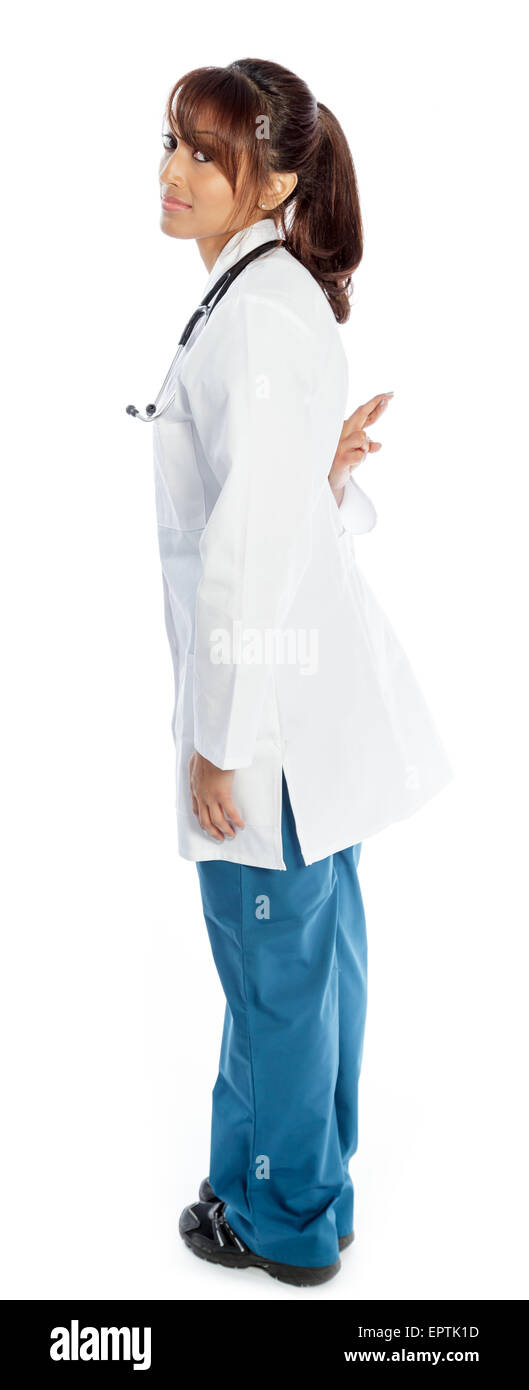 Attractive Indian doctor woman posing in a studio in front of a ...