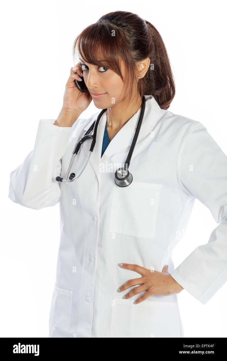 Attractive Indian doctor woman posing in a studio in front of a ...