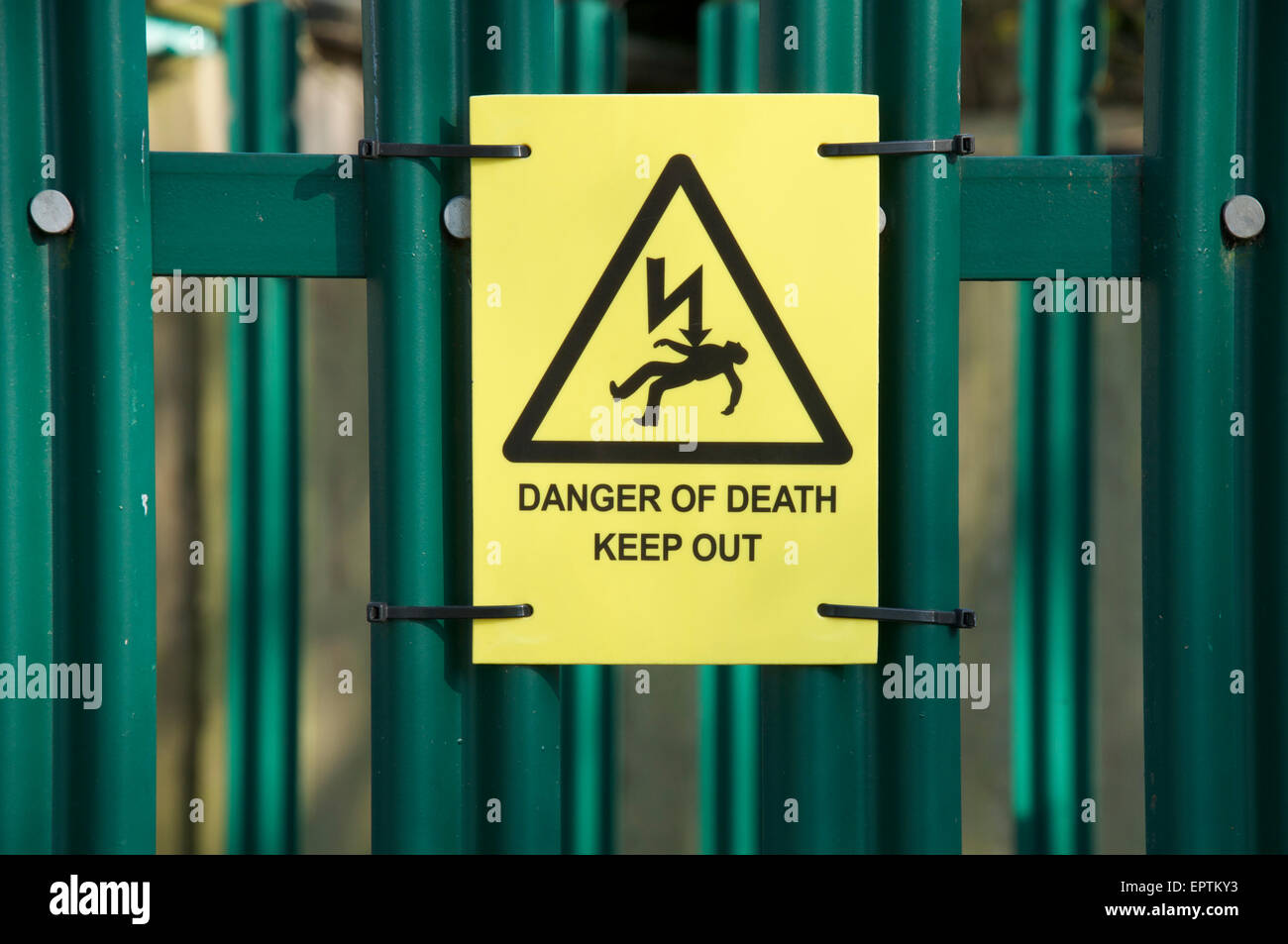 Danger of Death, Keep Out! Yellow hazard warning sign attached to the ...