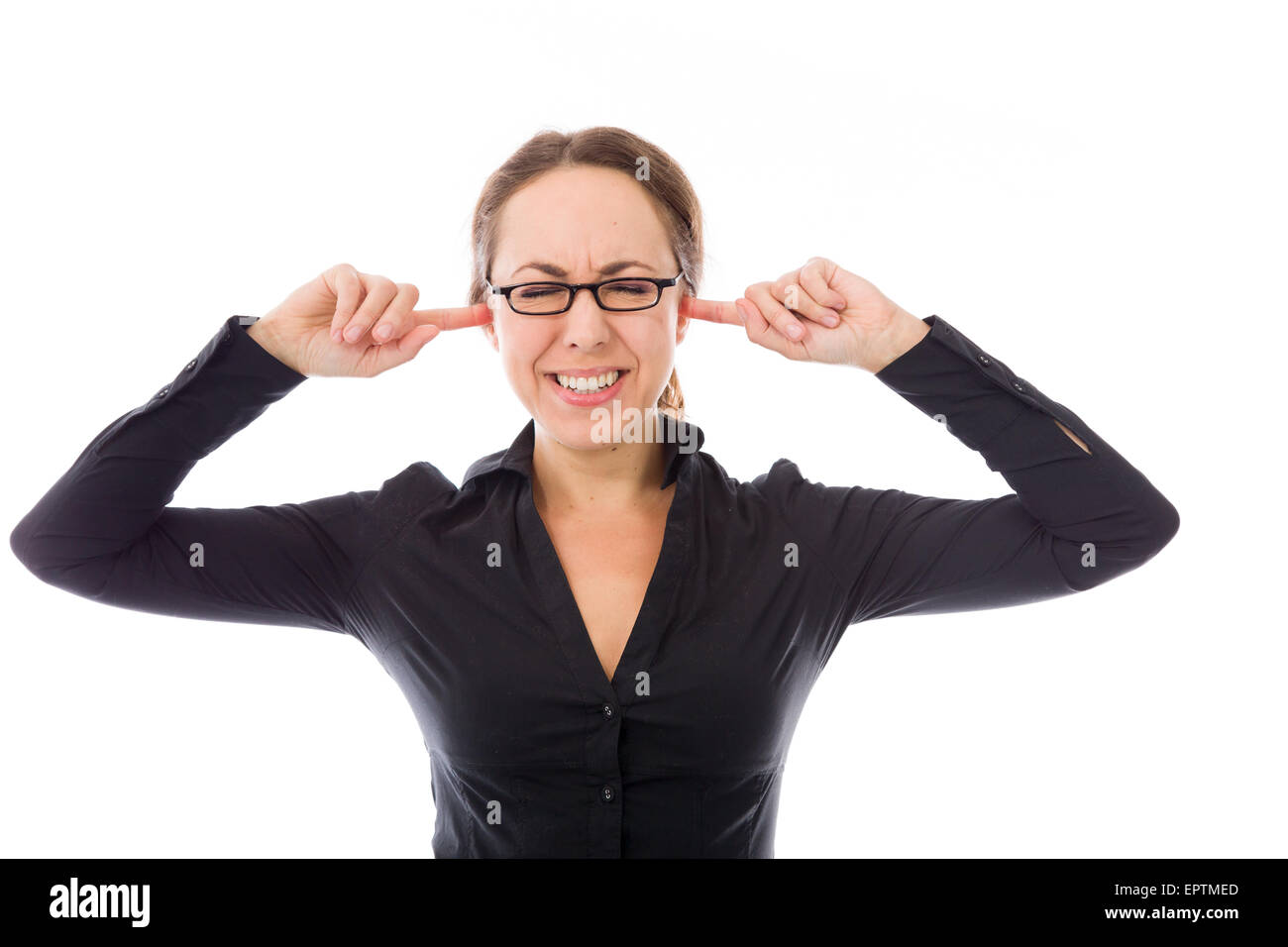 model isolated on plain background plugging ears with fingers Stock ...