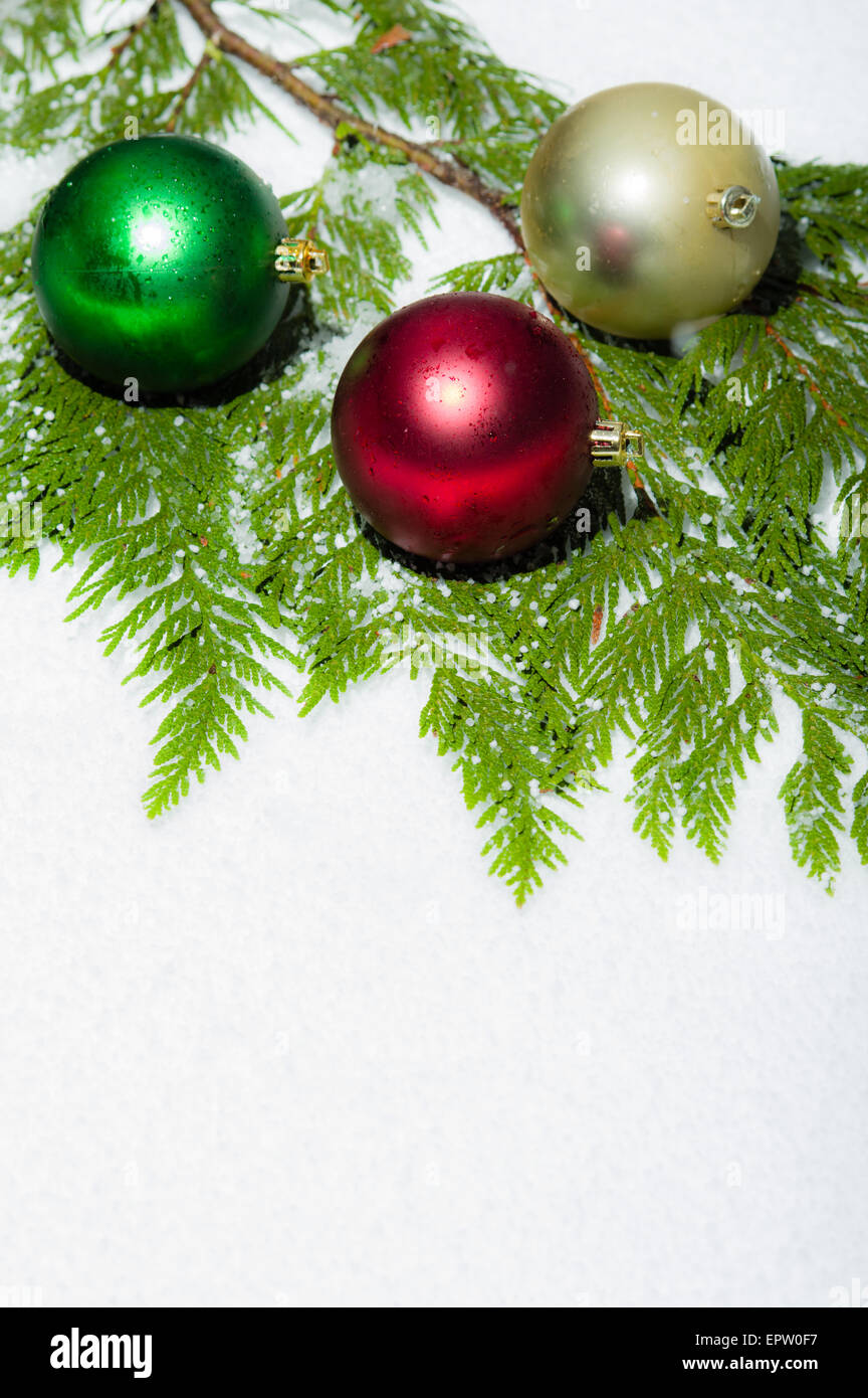 Vertical composition of three Christmas balls on snow Stock Photo - Alamy