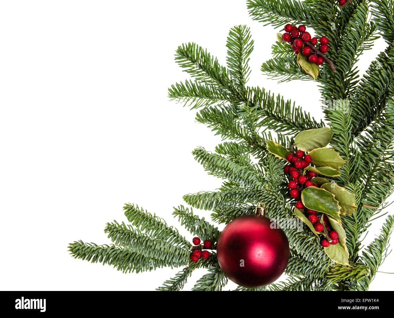A corner border of noble fir boughs with red ball Stock Photo - Alamy