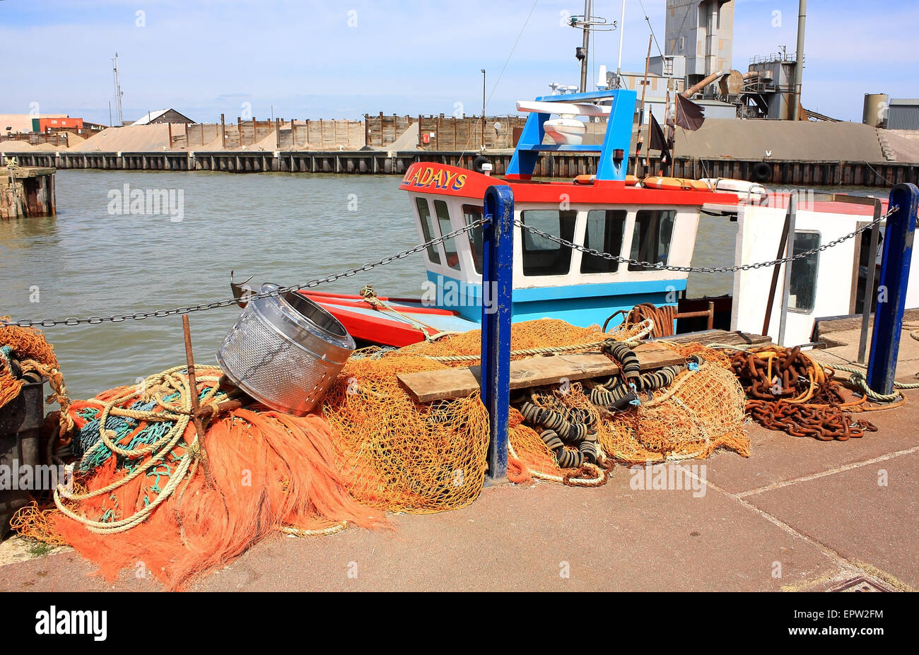 A fishing boat at Whitstable with its nets on view Stock Photo - Alamy