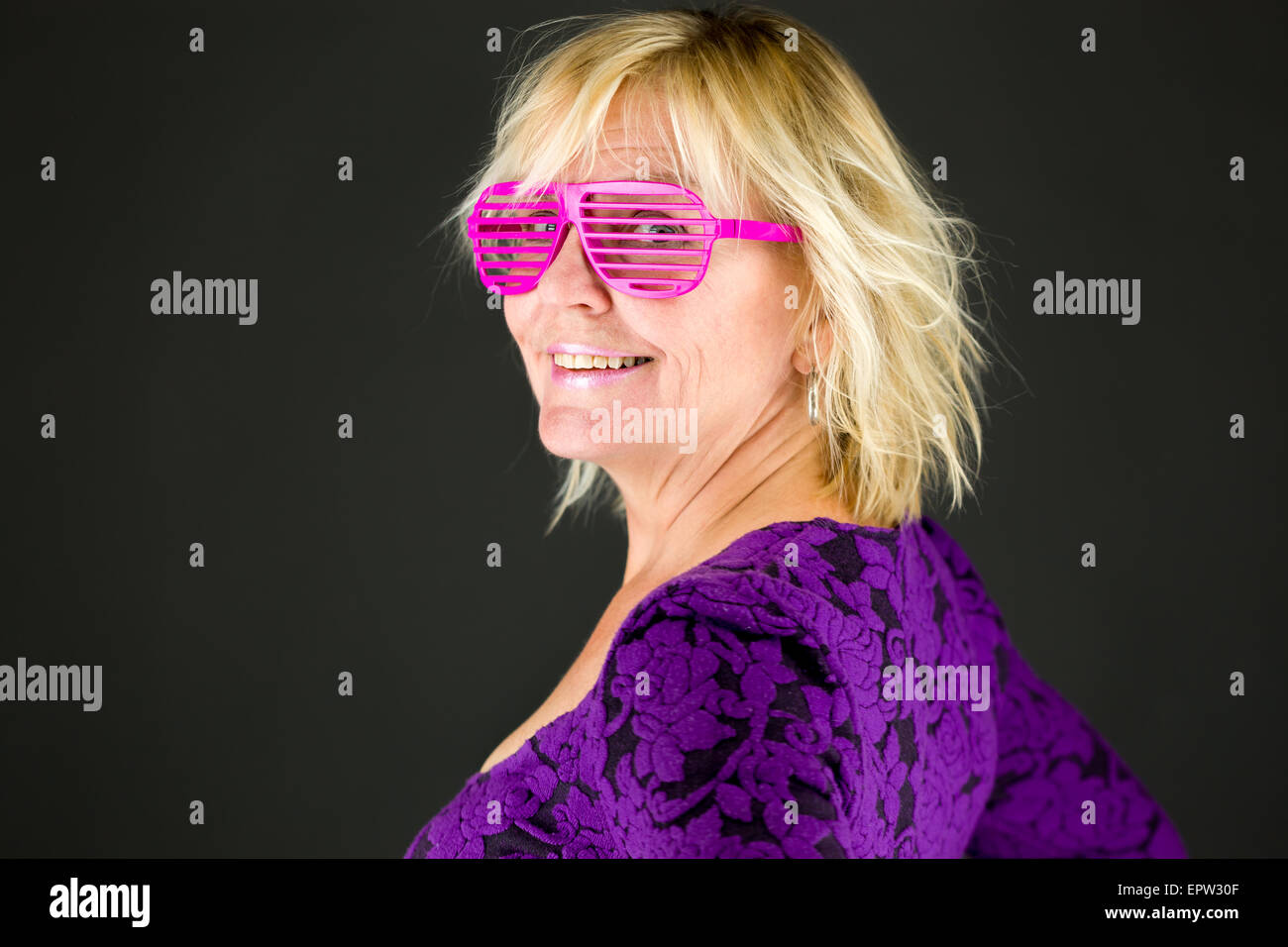 Model in studio isolated on plain grey background Stock Photo - Alamy