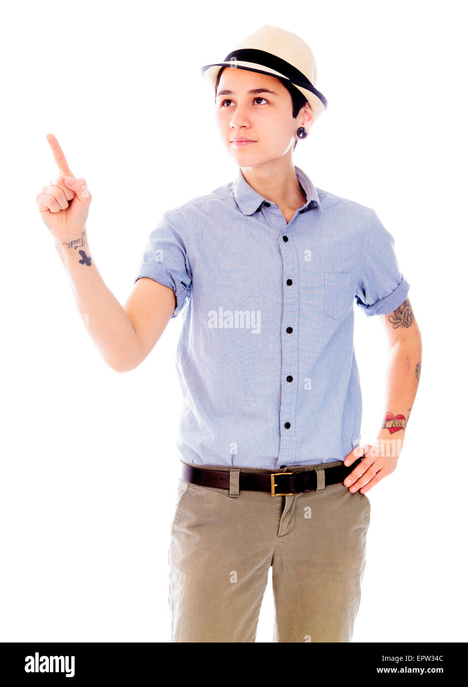 Young woman standing with hand on hip and pointing Stock Photo - Alamy