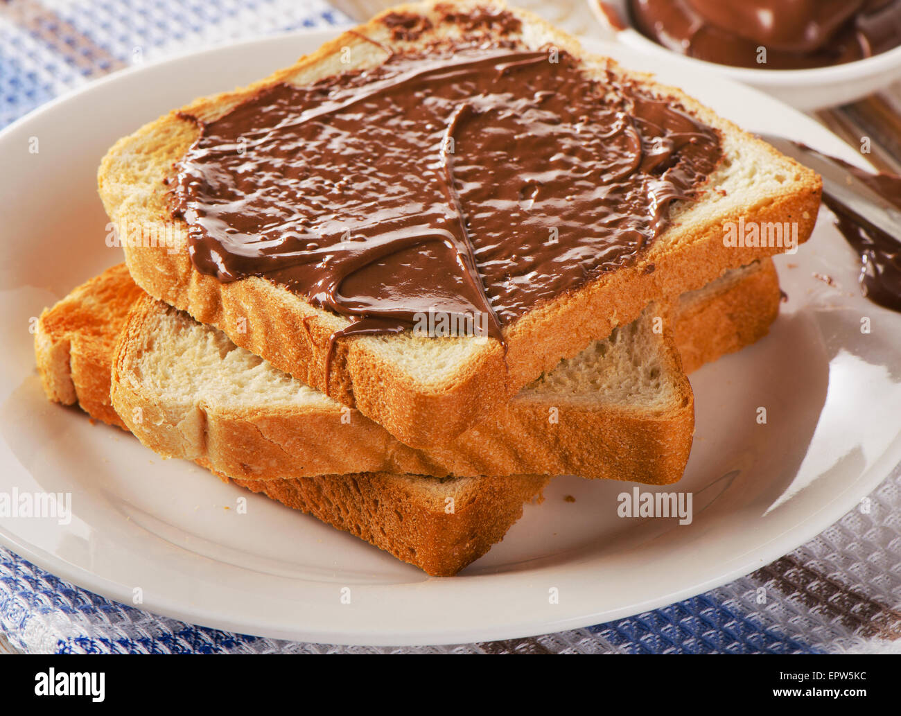 Fresh Toast with chocolate spread on white plate Stock Photo - Alamy