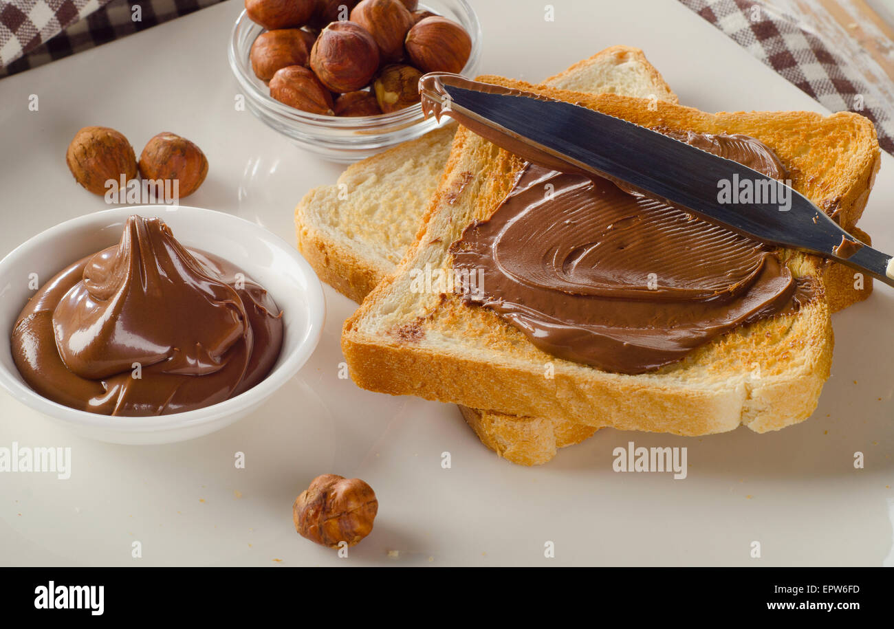 Toast with chocolate spread for sweet breakfast Stock Photo - Alamy