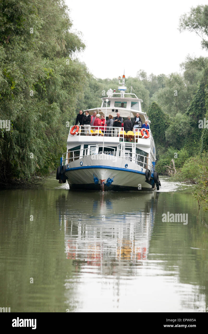 An excursion boat with tourists in the Danube delta in Romania Stock ...